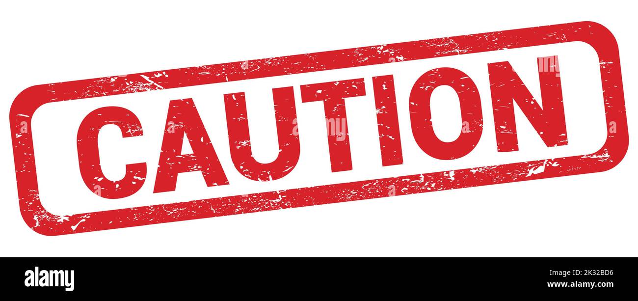 CAUTION text written on red rectangle stamp sign Stock Photo - Alamy