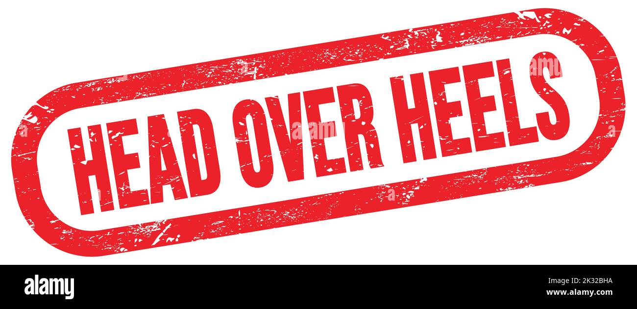 HEAD OVER HEELS, text on red rectangle stamp sign Stock Photo - Alamy