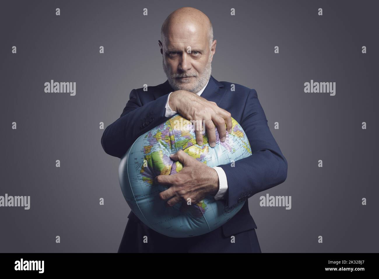 Greedy corporate businessman crushing a globe: earth exploitation and ...