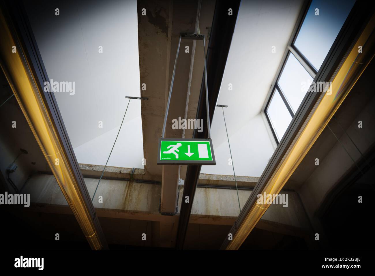 emergency exit sign in a school building Stock Photo - Alamy