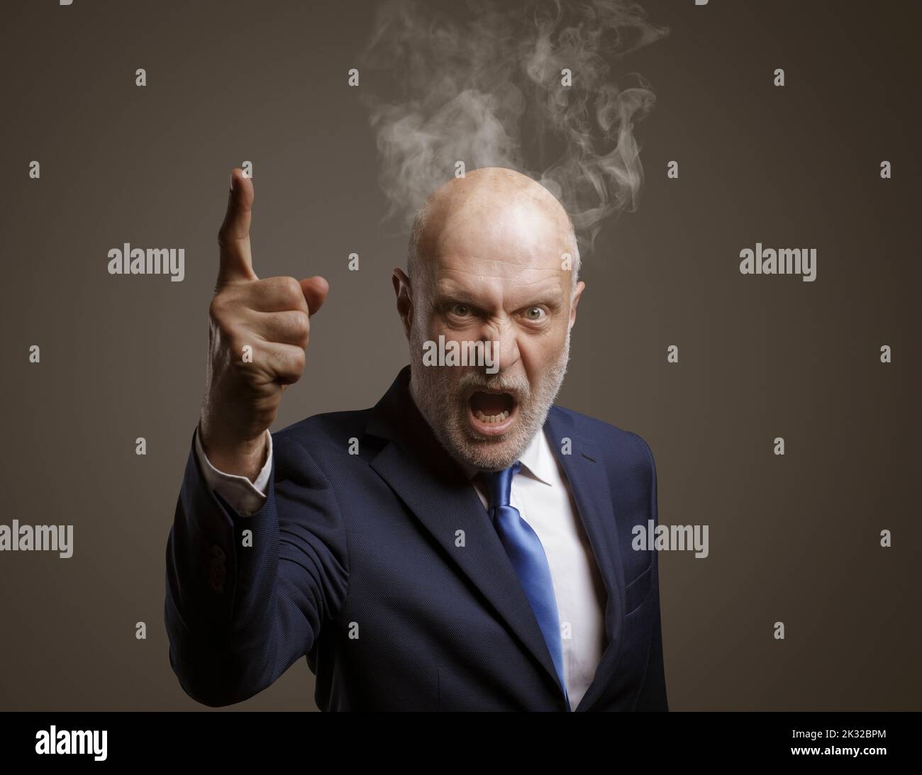 Angry boss shouting at camera, he is scolding an employee Stock Photo ...