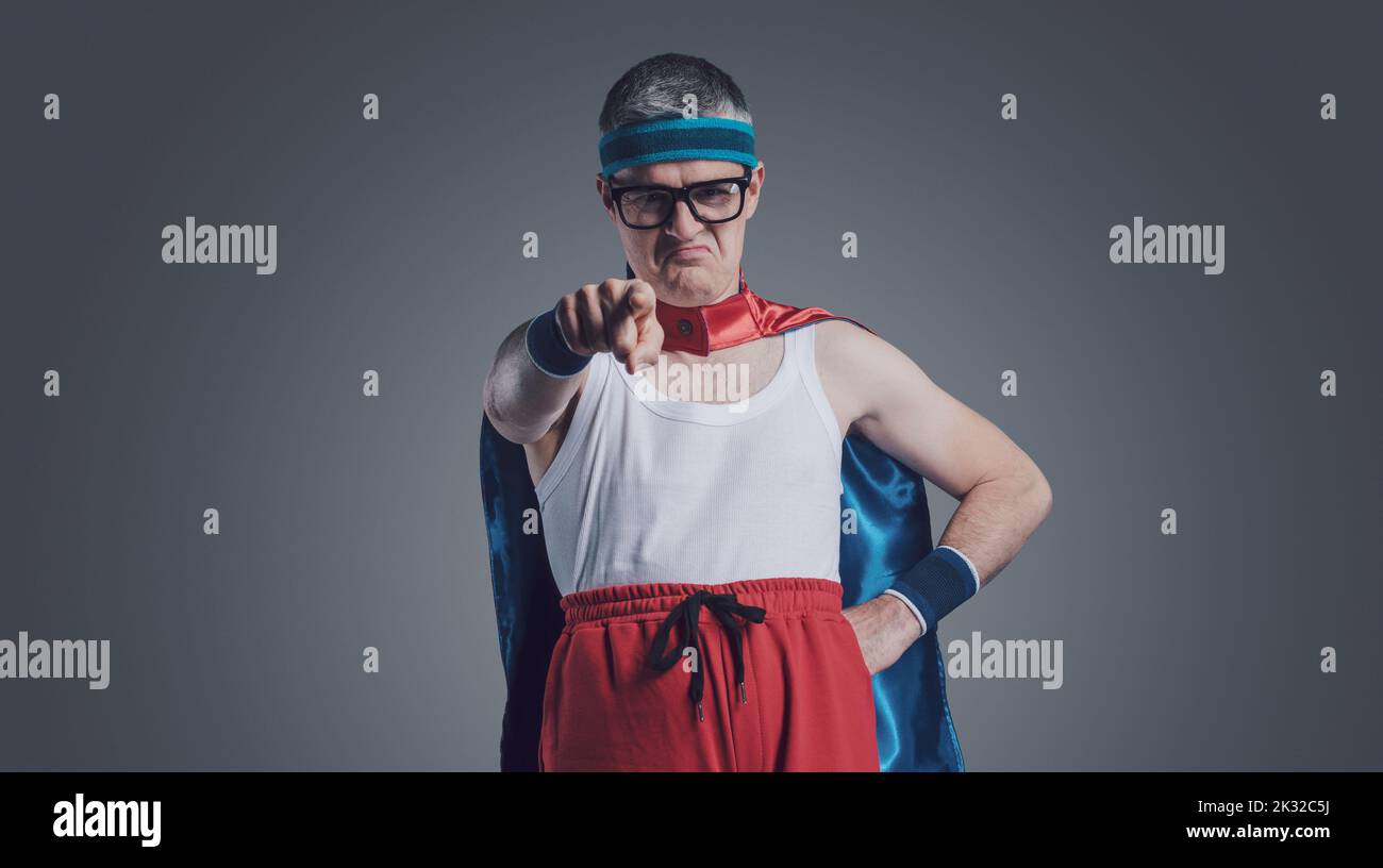 Funny nerdy superhero with confident expression pointing at camera ...