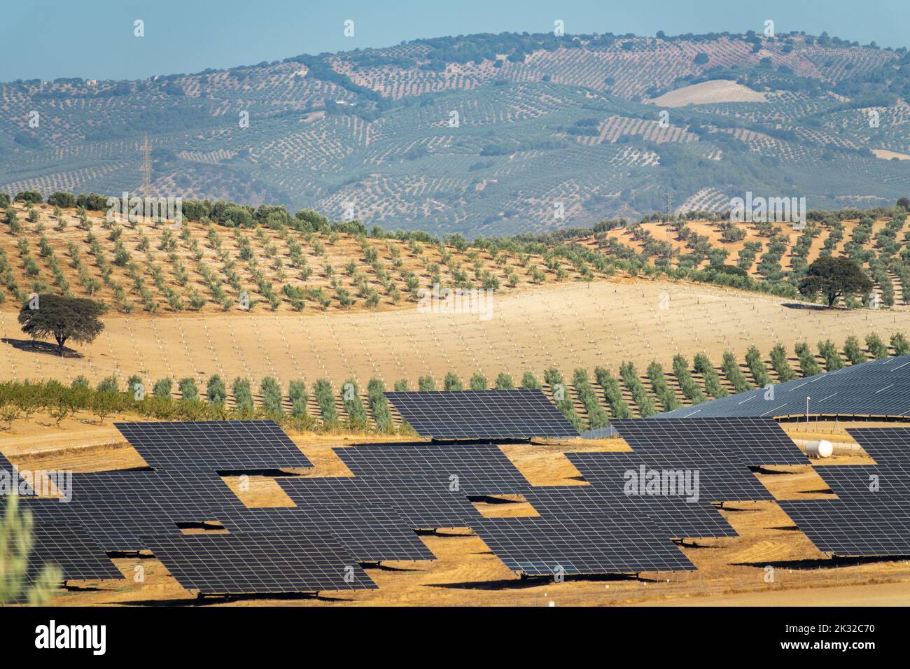 Large solar power plant with large extensions of solar panels between ...