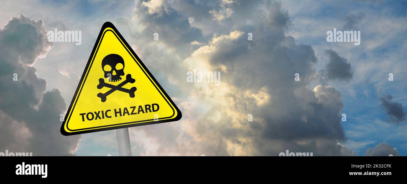 toxic hazard sign on cloudy background Stock Photo - Alamy