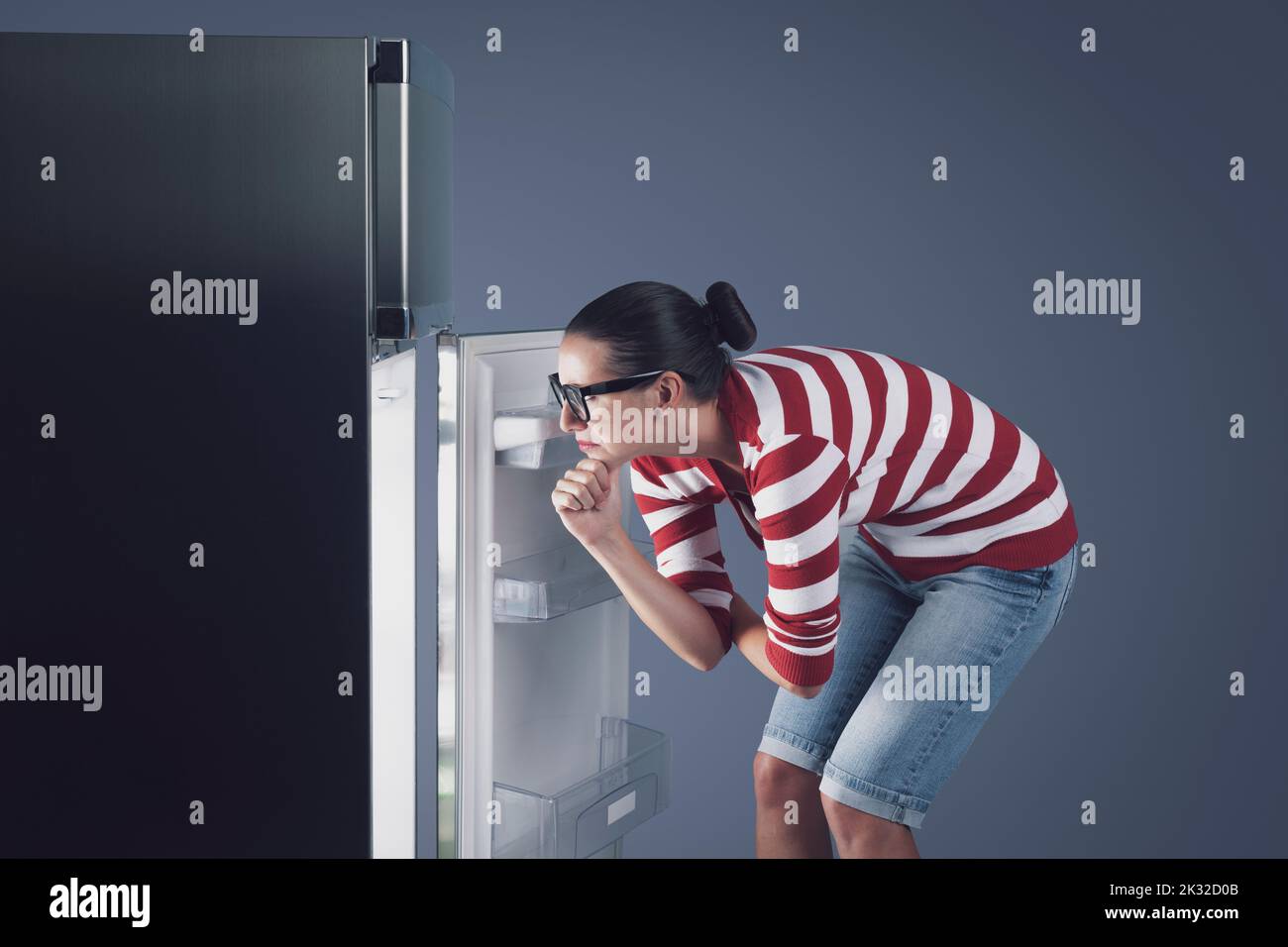 Looking in the fridge hi-res stock photography and images - Alamy