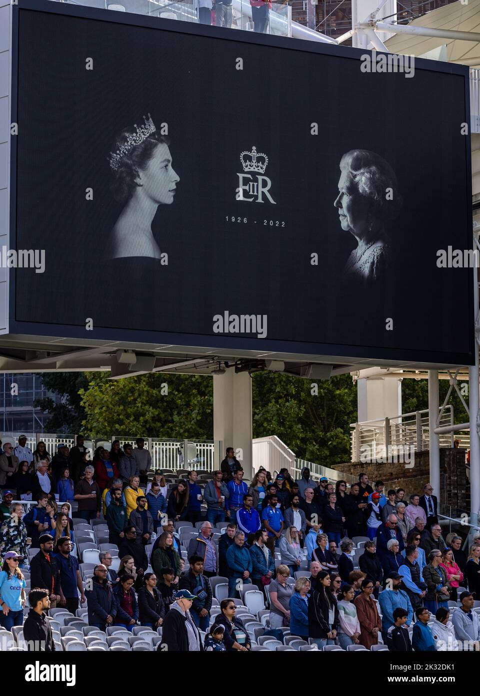 Images of Queen Elizabeth II are displayed on the giant screens ahead ...