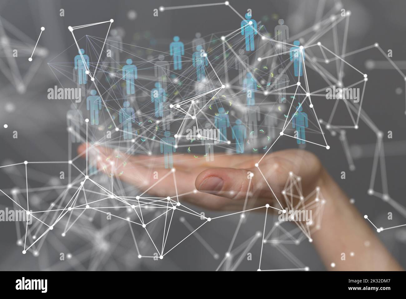 The hand holding blue man icons on her palm. Global networking concept ...