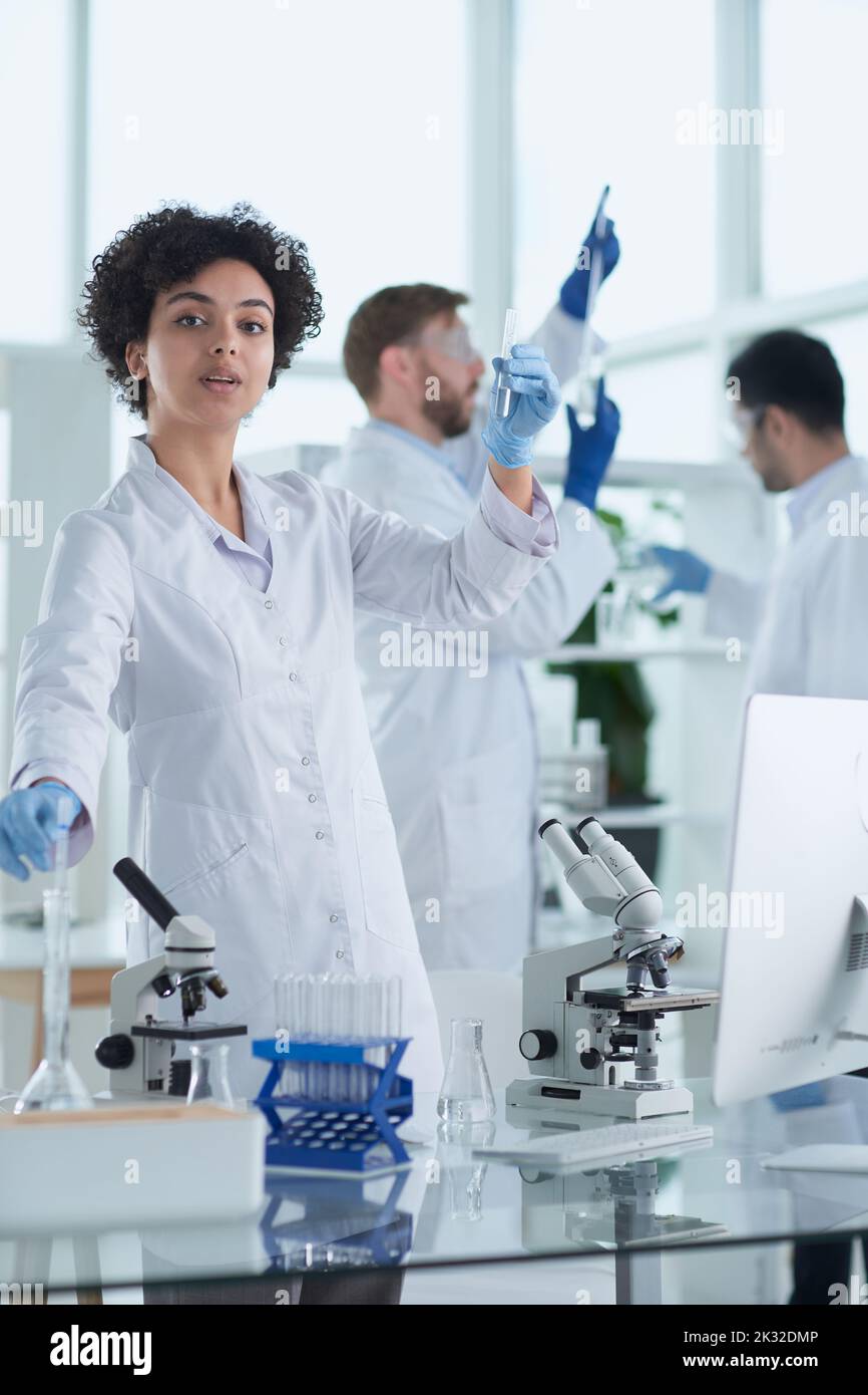 Smiling scientists looking at camera arms crossed in laboratory Stock ...