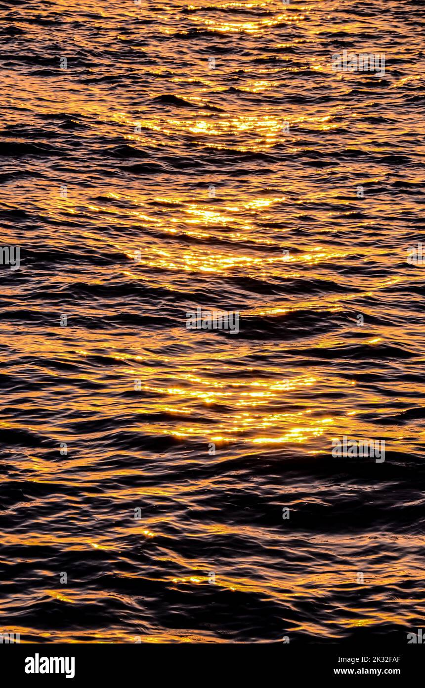 The vertical high-angle view of water waves at sunset Stock Photo - Alamy