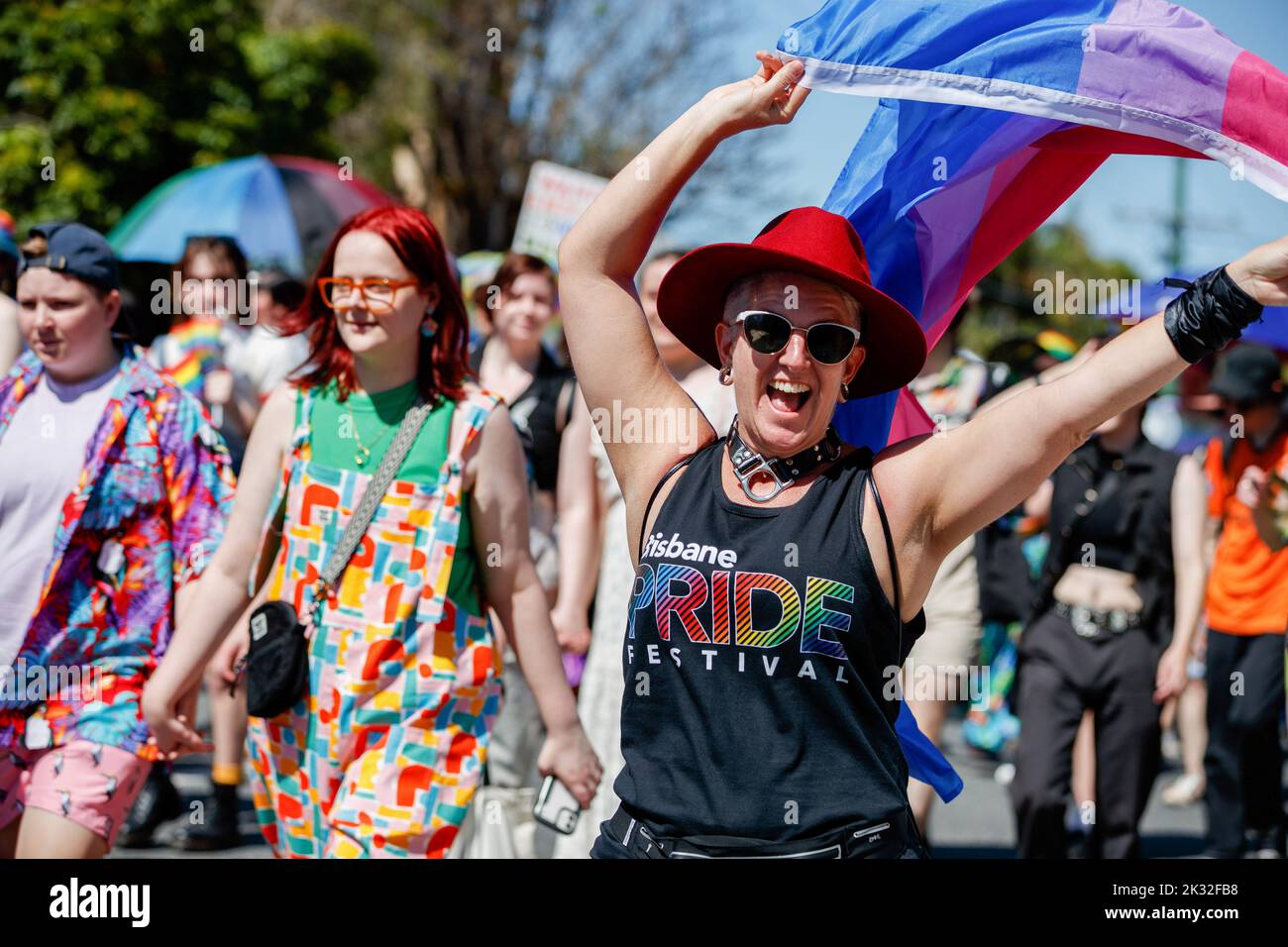Brisbane, Australia. 24th Sep, 2022. A marcher seen waving a flag ...