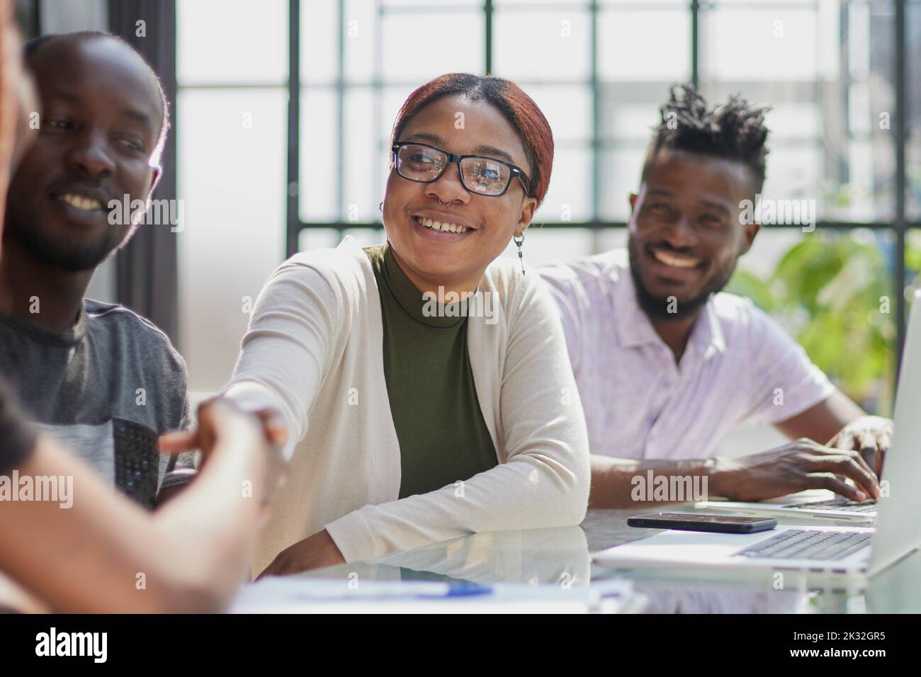 African american hr team welcoming female applicant at job interview ...
