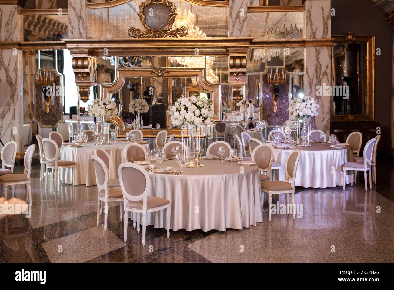 Tables setting at a luxury wedding. Table for guests. Dishes and drinks ...