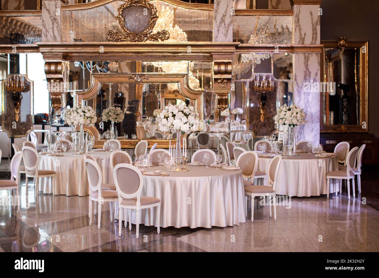 Tables setting at a luxury wedding. Table for guests. Dishes and drinks ...