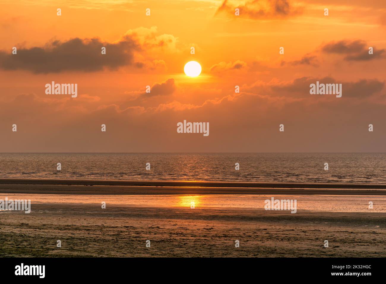 Scenic view of sunset over Deauville beach in Normandy, France against dramatic golden sky Stock ...