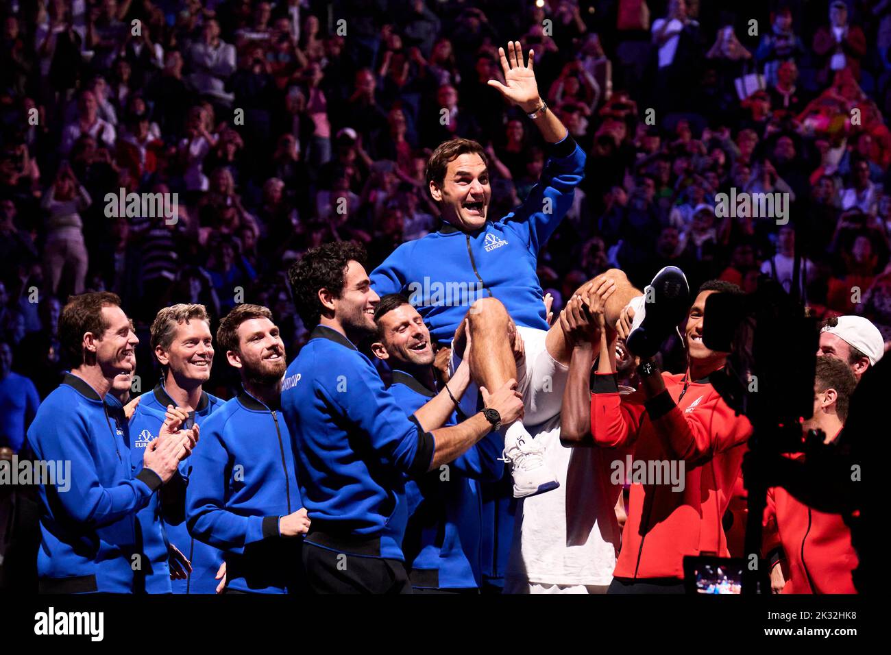 Team Europe's Roger Federer is lifted up by both teams after his final ...