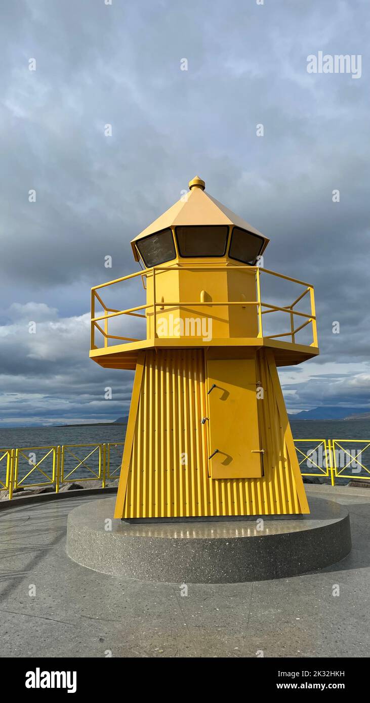 A beautiful view of a yellow lighthouse, Tourist attraction in ...