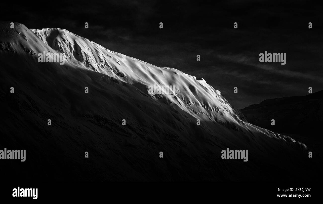 A minimalistic beautiful grayscale background of a snowy mountain at ...