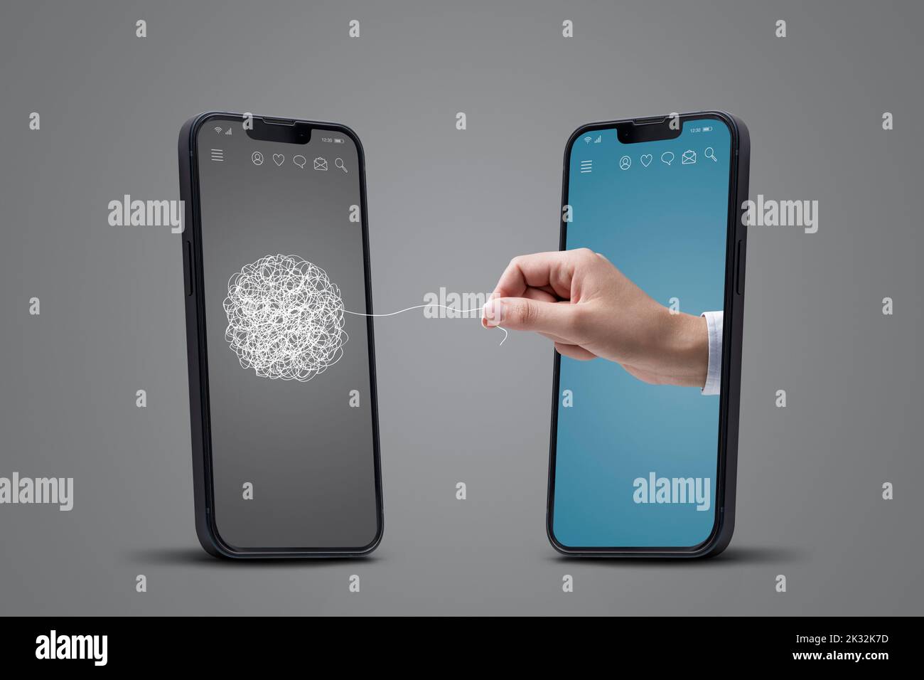 Two smartphones facing each other, a hand is untangling a line on the ...