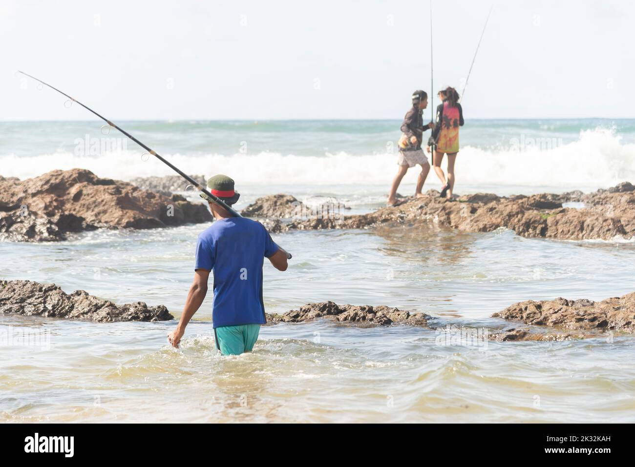 The fishermen fishing on the famous Boca do Rio beach in Salvador ...