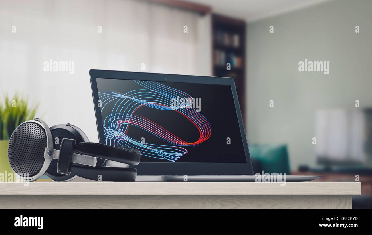 Laptop with sound waves on the screen and headphones at home Stock ...