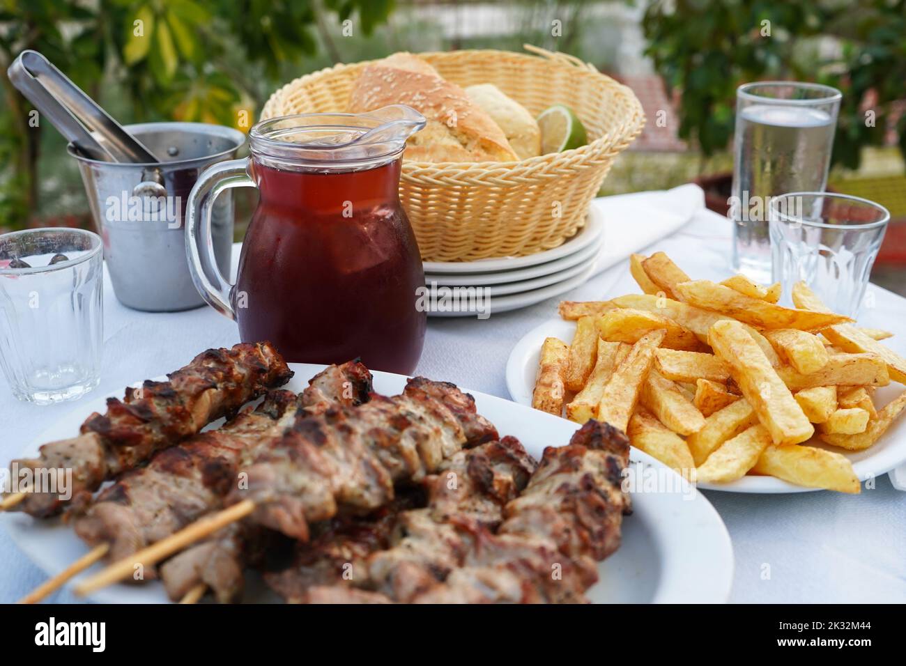 selective focus on wine of typical layout of greek table including the ...