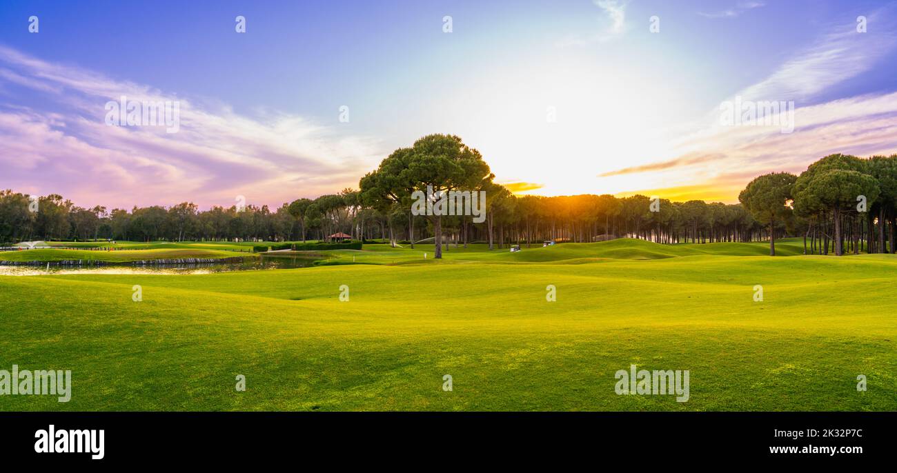 Golf course panorama at sunset with beautiful sky. Scenic panoramic ...