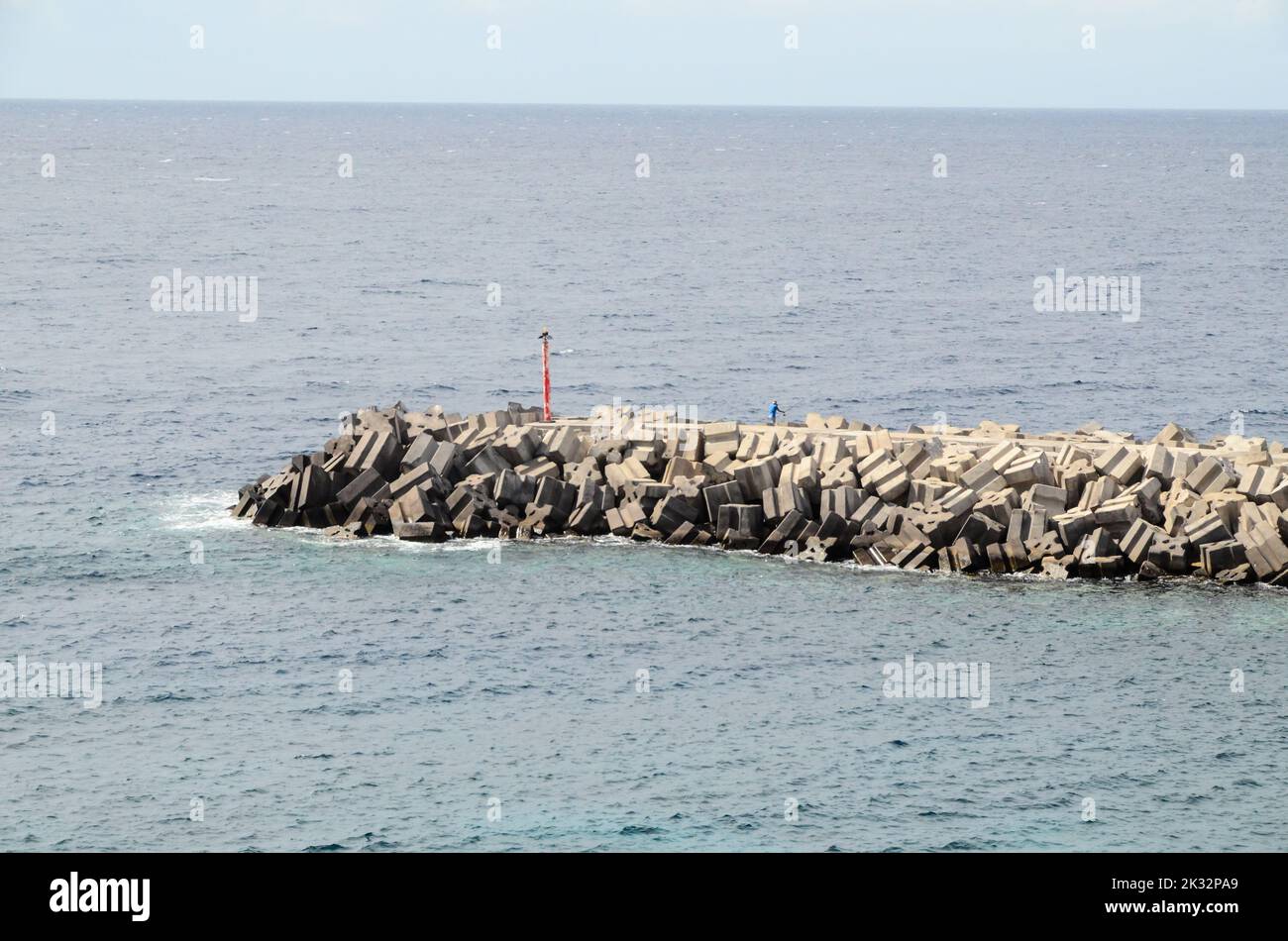 A stone pier in the ocean Stock Photo - Alamy