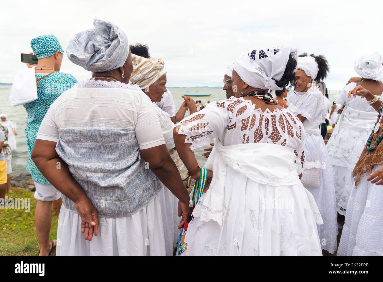 The Candomble members during a celebration in the waters of Santo Amaro ...