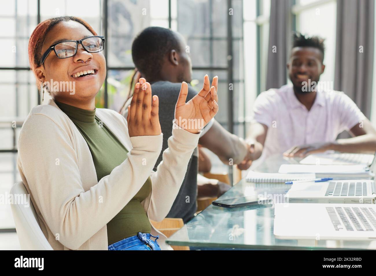 Business handshake in the office. african american team Stock Photo - Alamy