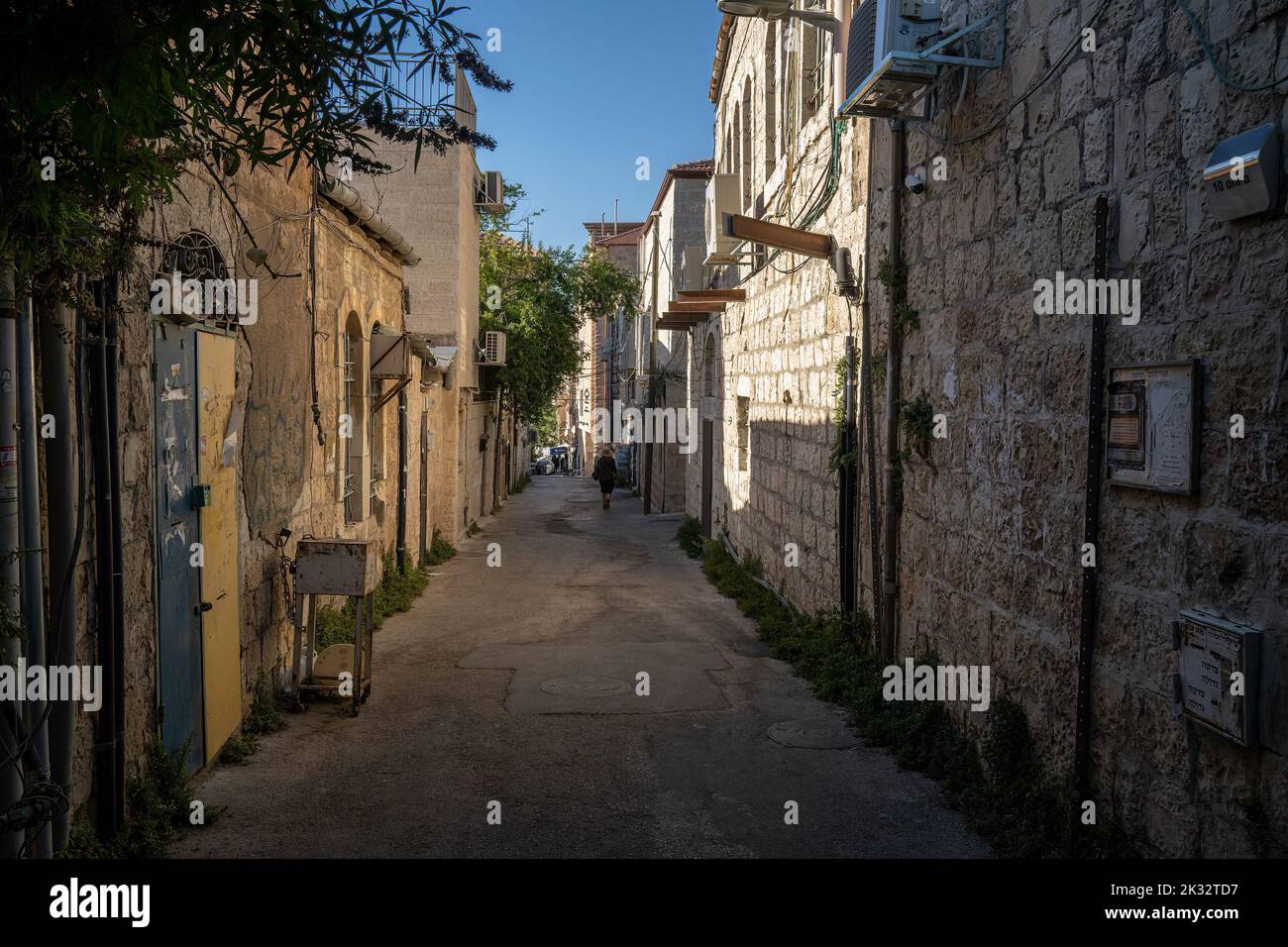 Jerusalem, Israel - July 7th, 2022: A typical shady alley in one of the ...