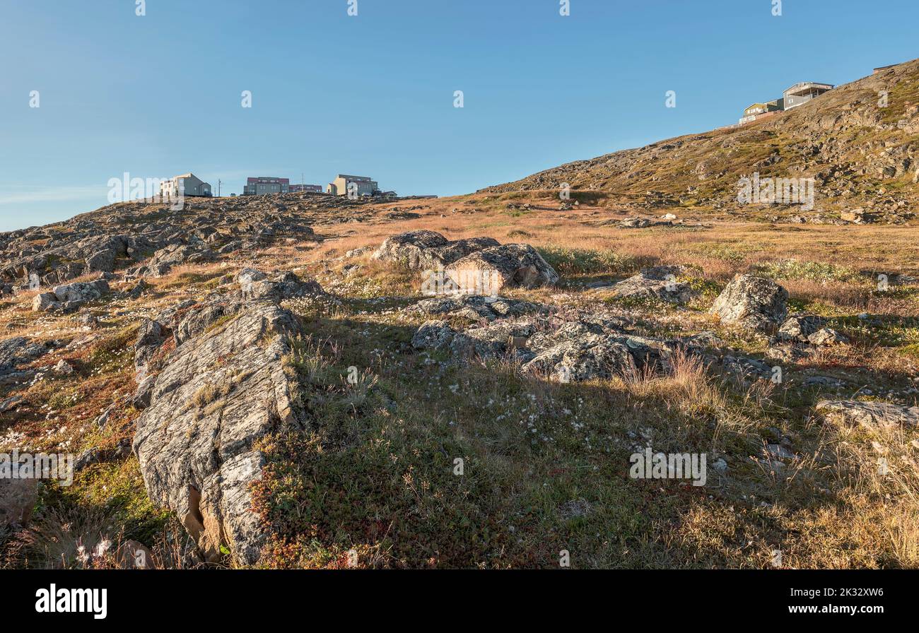 Houses on a rocky ridge in the city of Iqaluit in Nunavut, Canada Stock ...