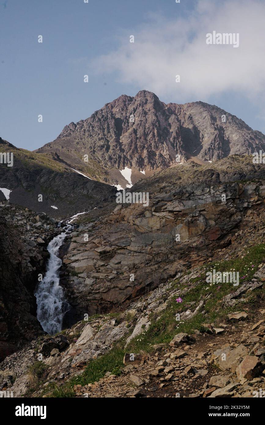 A vertical landscape of the Crow Pass mountain pass in Alaska with a ...