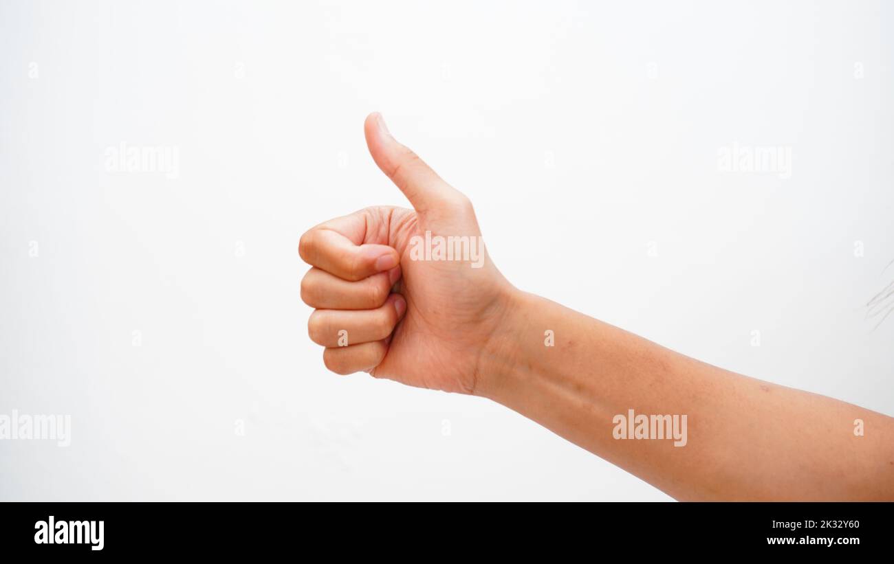 A thumbs up hand gesture isolated on a white background Stock Photo - Alamy