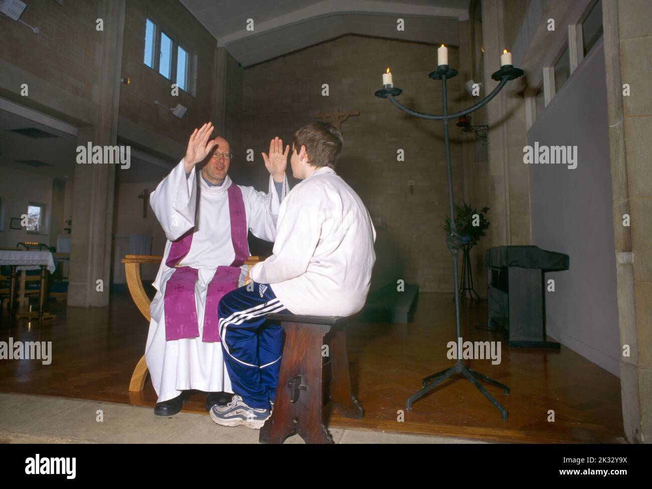 Catholic priest confession hi-res stock photography and images - Alamy