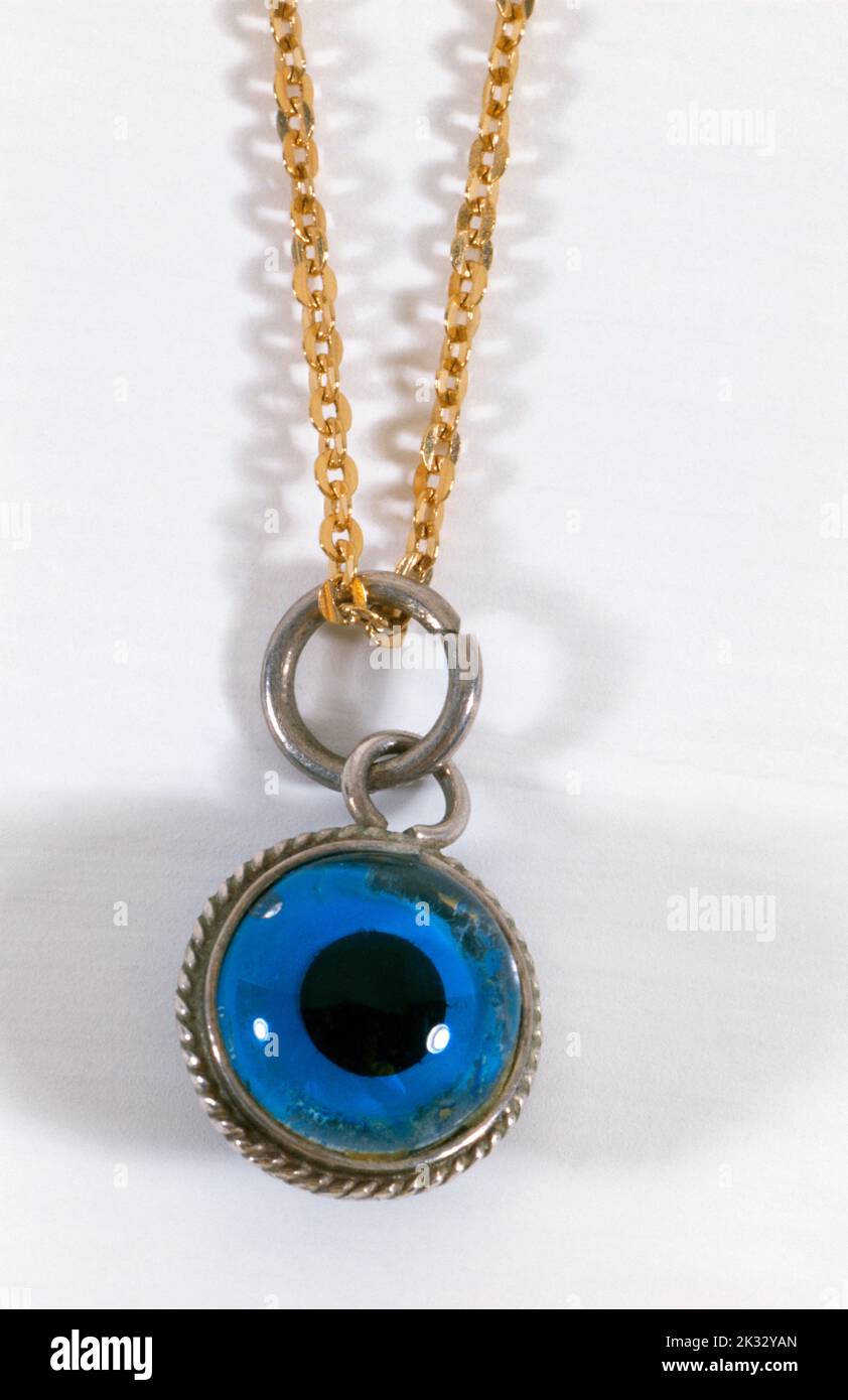 Greek Evil Eye Pendant on Gold Chain Stock Photo - Alamy
