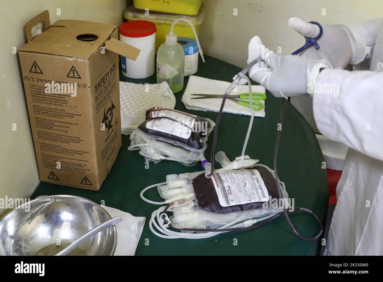 A laboratory technologist seen processing blood at Nakuru Regional ...