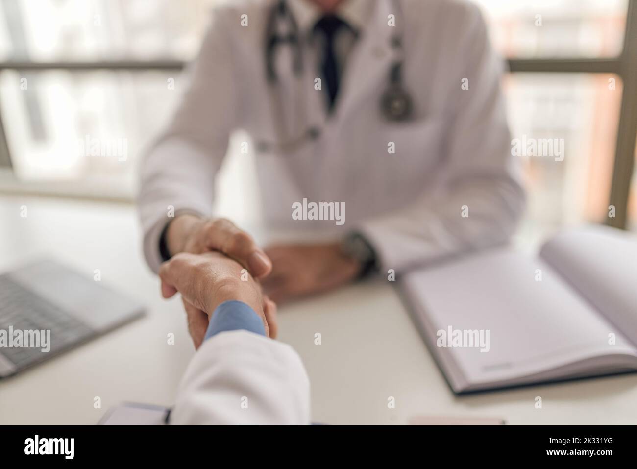 Closeup picture of doctors agreeing on the diagnosis of the patient ...