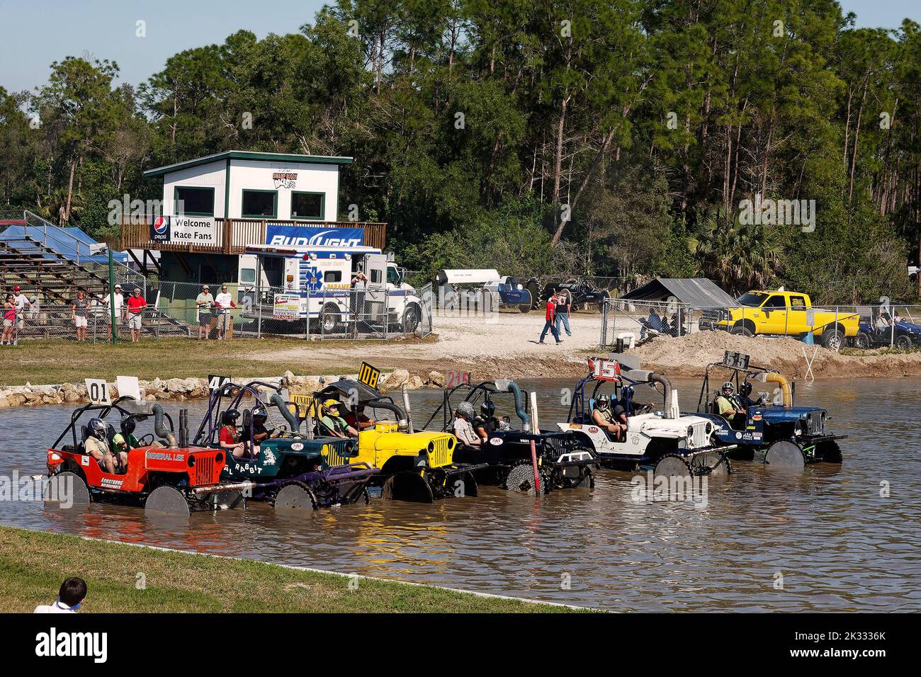 swamp buggies lined up, in water, starting race, vehicle sport, fast ...