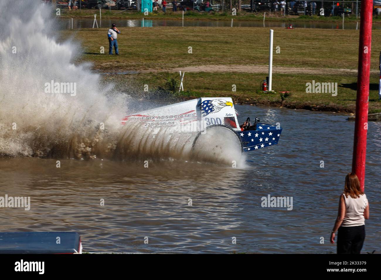 swamp buggy racing, very large water spray, spectators, action, contest ...
