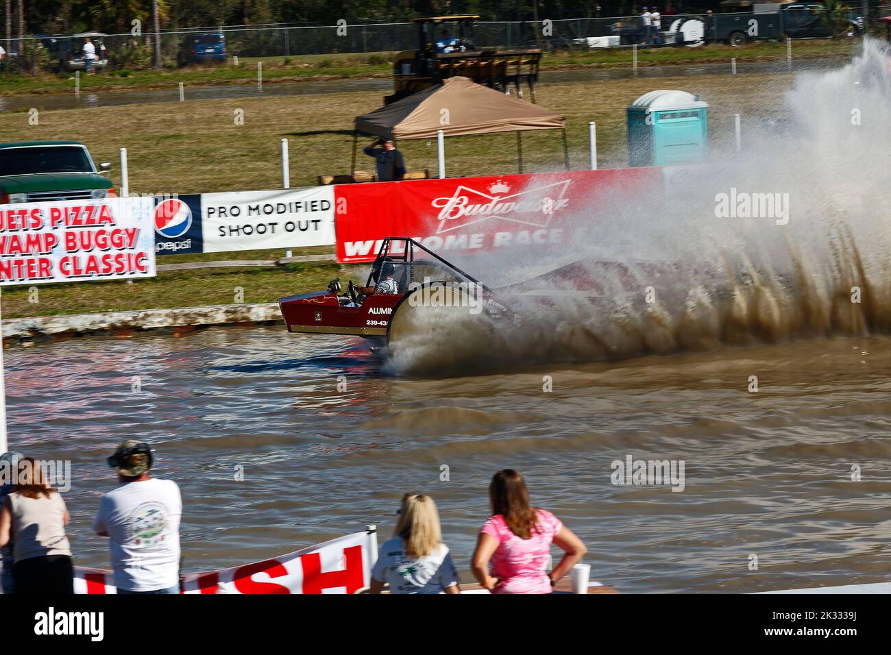 swamp buggy racing, very large water spray, repeating pattern, action ...