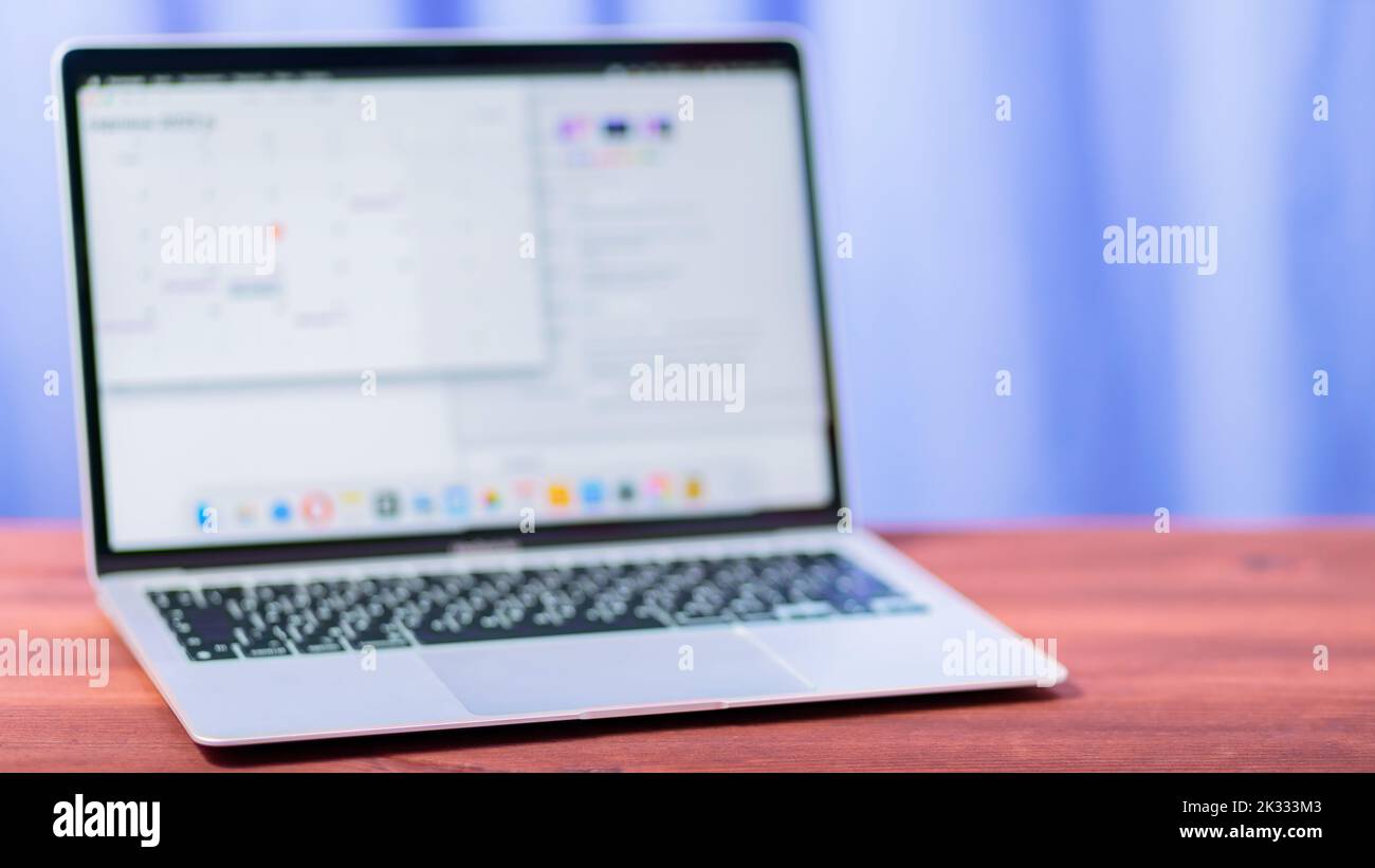 Open laptop on the table. Blurred laptop screen while working. Device ...