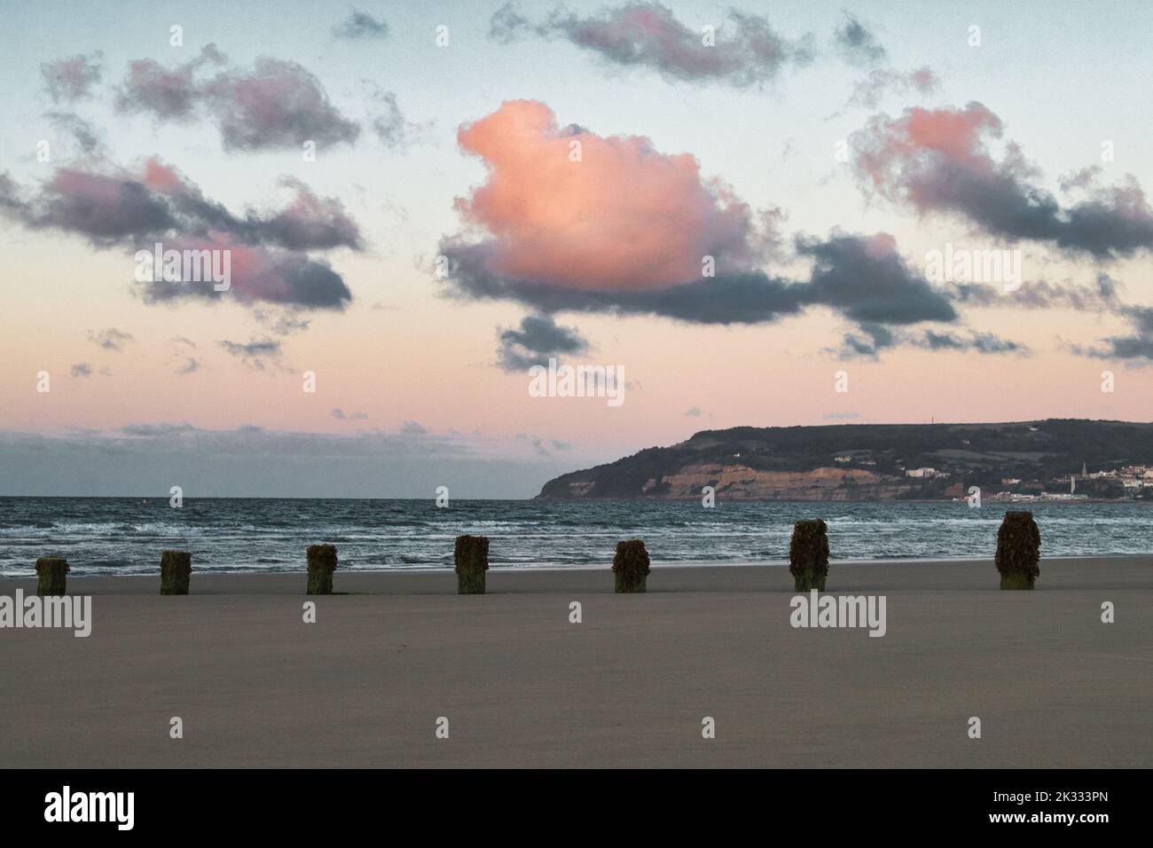 A beautiful shot of a sunset sky over the sandy beach Stock Photo - Alamy