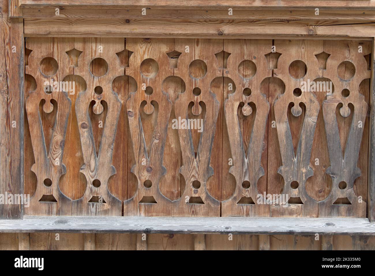 Close up of ornate light wood wooden balcony railing as a concept for ...