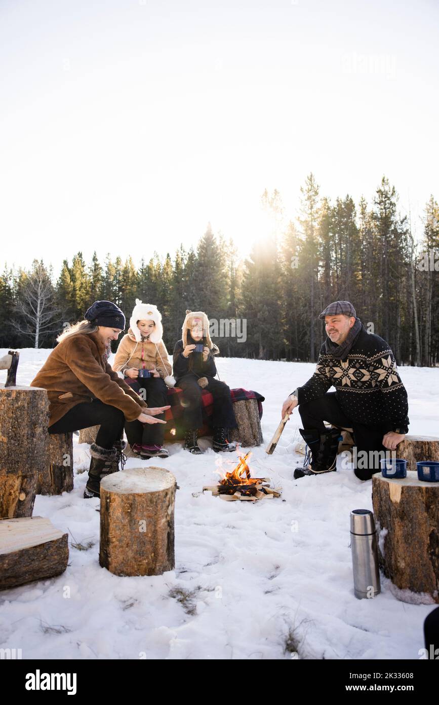 Sitting at fire hi-res stock photography and images - Alamy