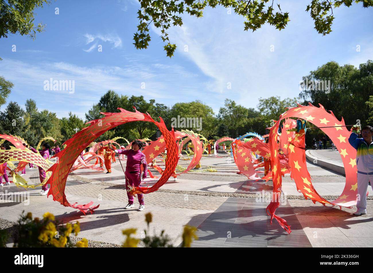 ZHANGJIAKOU, CHINA - SEPTEMBER 24, 2022 - Dragon dance lovers perform ...