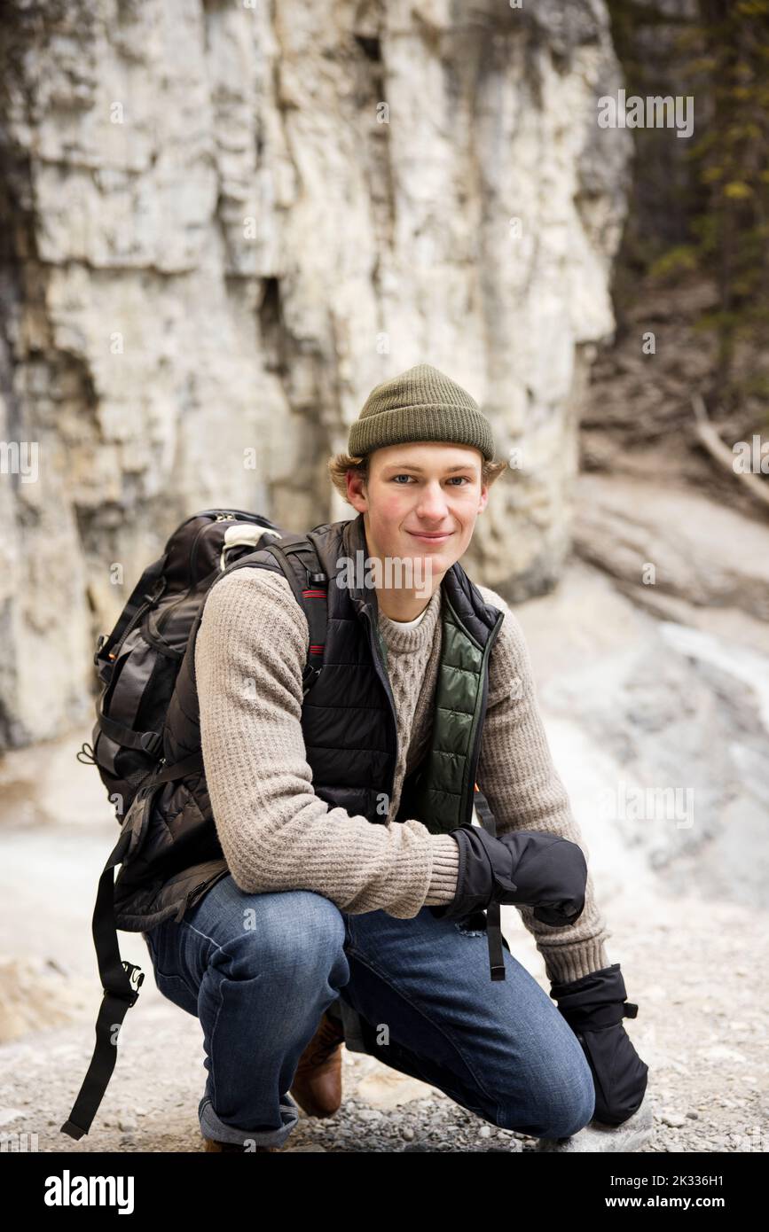 Man crouching in wilderness hi-res stock photography and images - Alamy