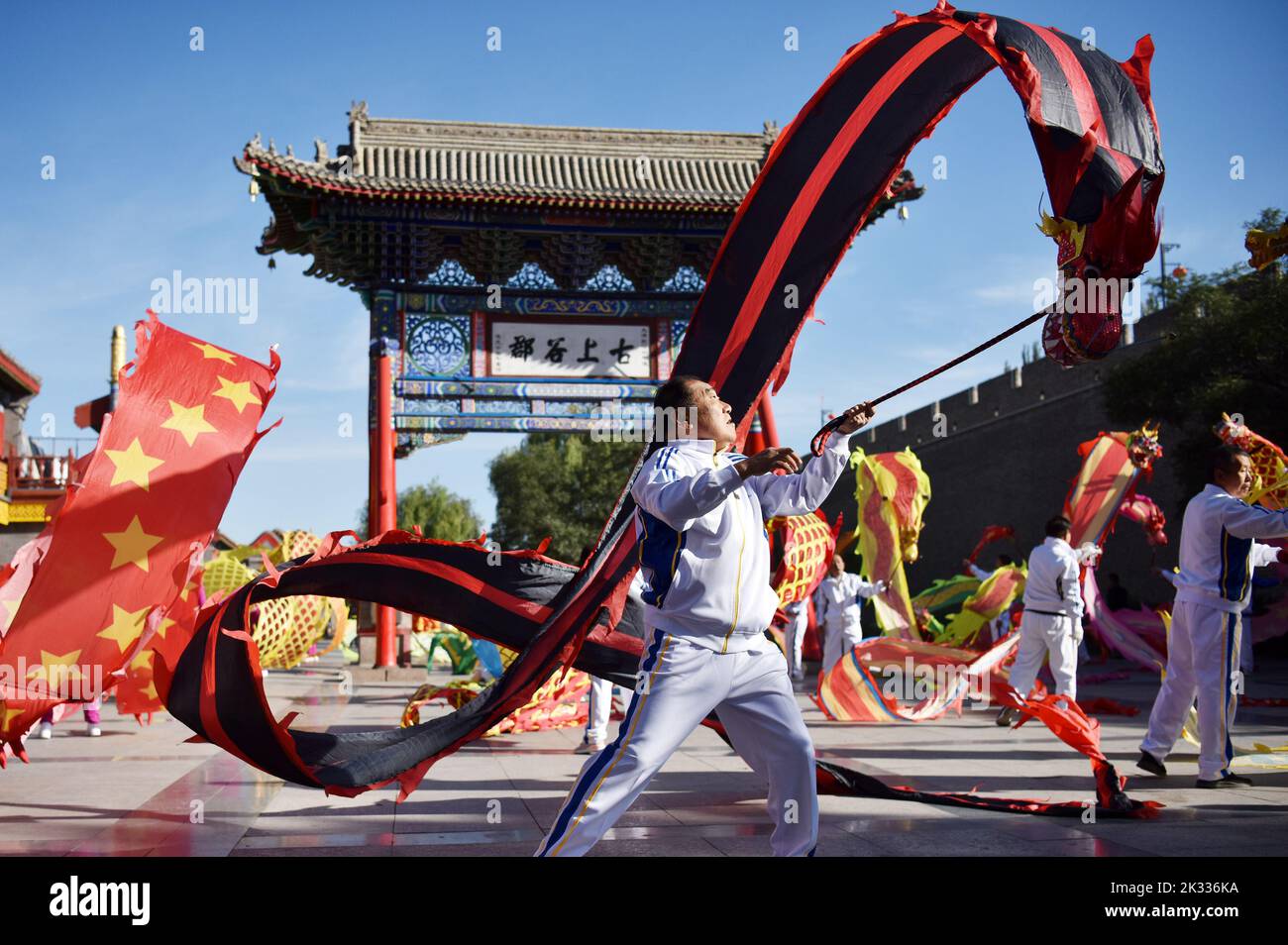 ZHANGJIAKOU, CHINA - SEPTEMBER 24, 2022 - Dragon dance lovers perform ...