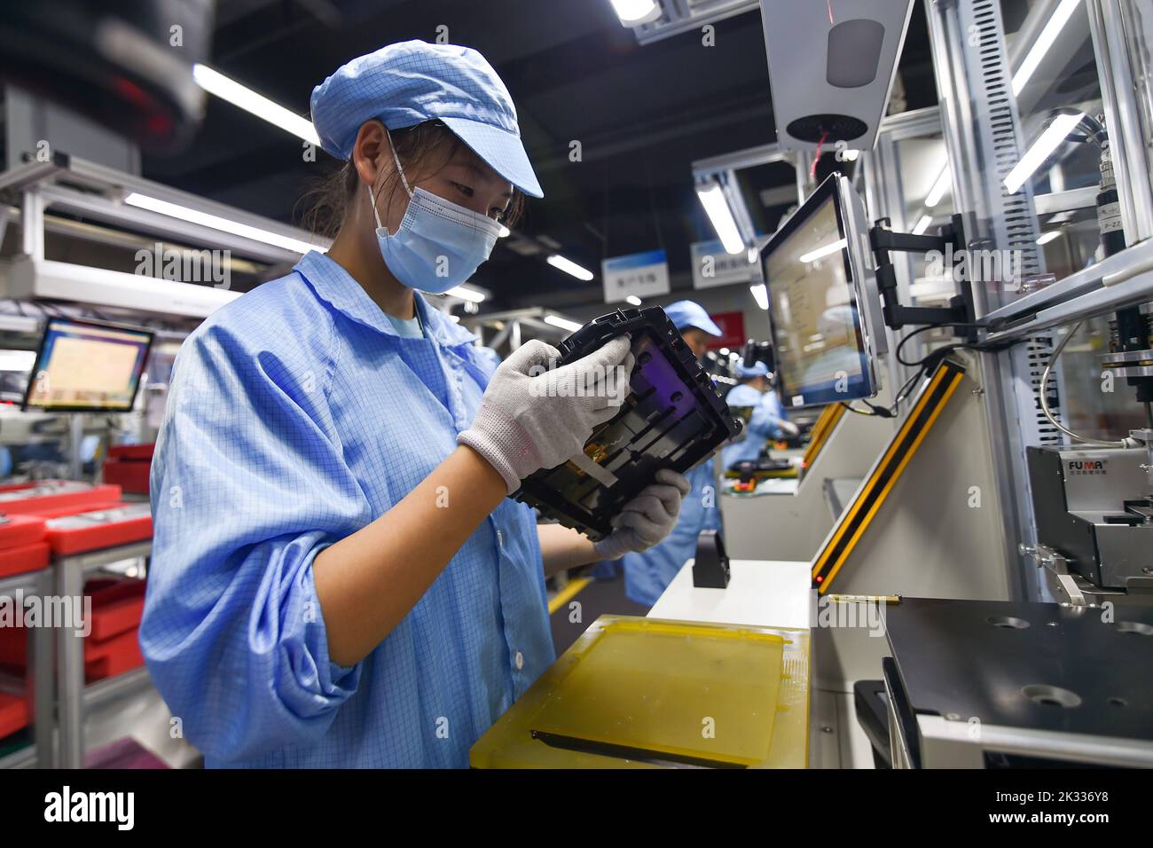 SUQIAN, CHINA - SEPTEMBER 23, 2022 - Workers assemble and produce a ...