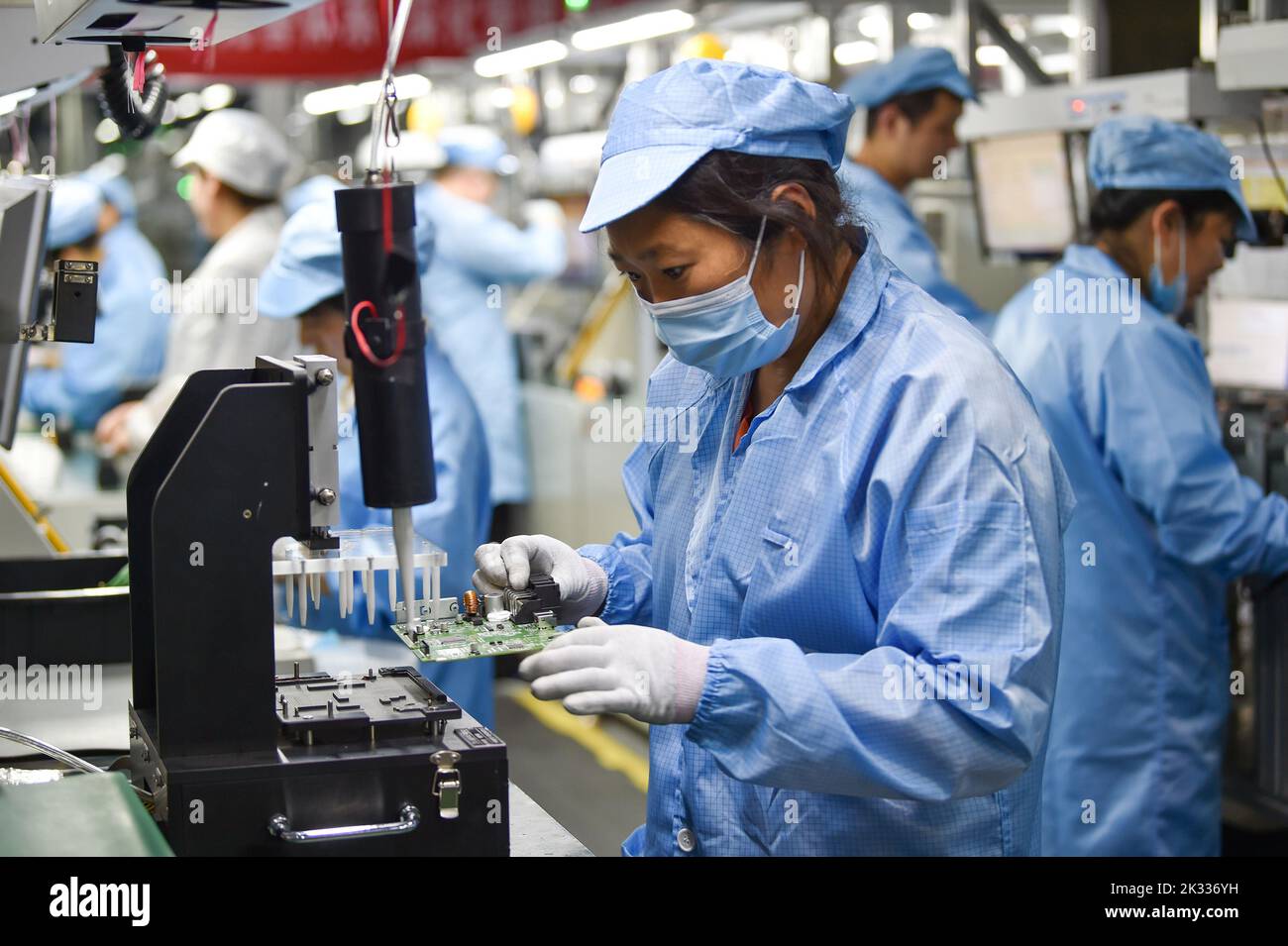 SUQIAN, CHINA - SEPTEMBER 23, 2022 - Workers assemble and produce a vehicle intelligent central ...