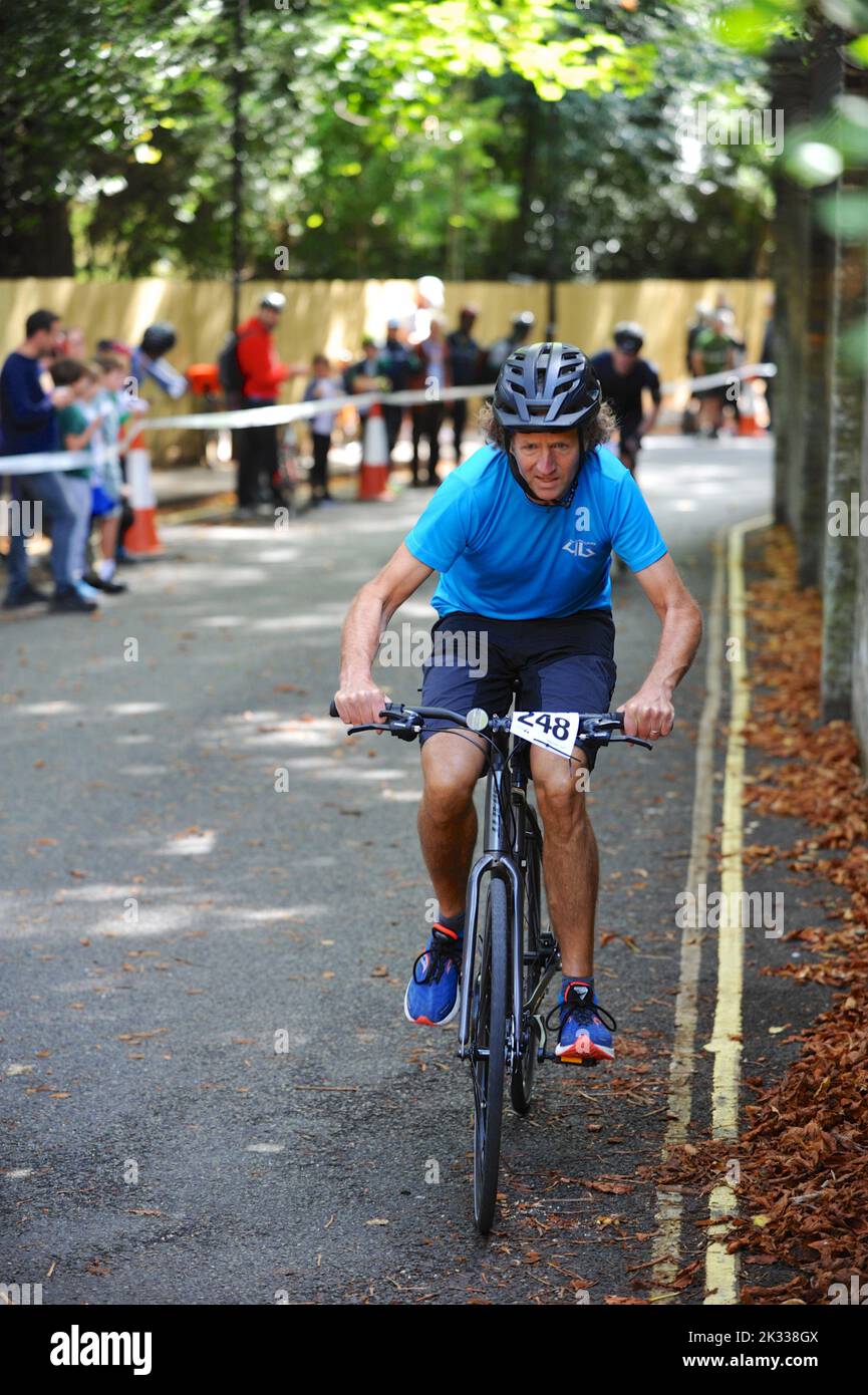 Henry Yates (rider No. 248) straining as they race up Swains Lane in ...